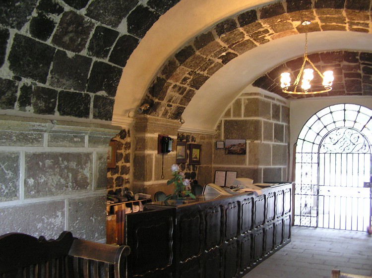 Photo: reception area and front desk...the volcanic walls throughout ...